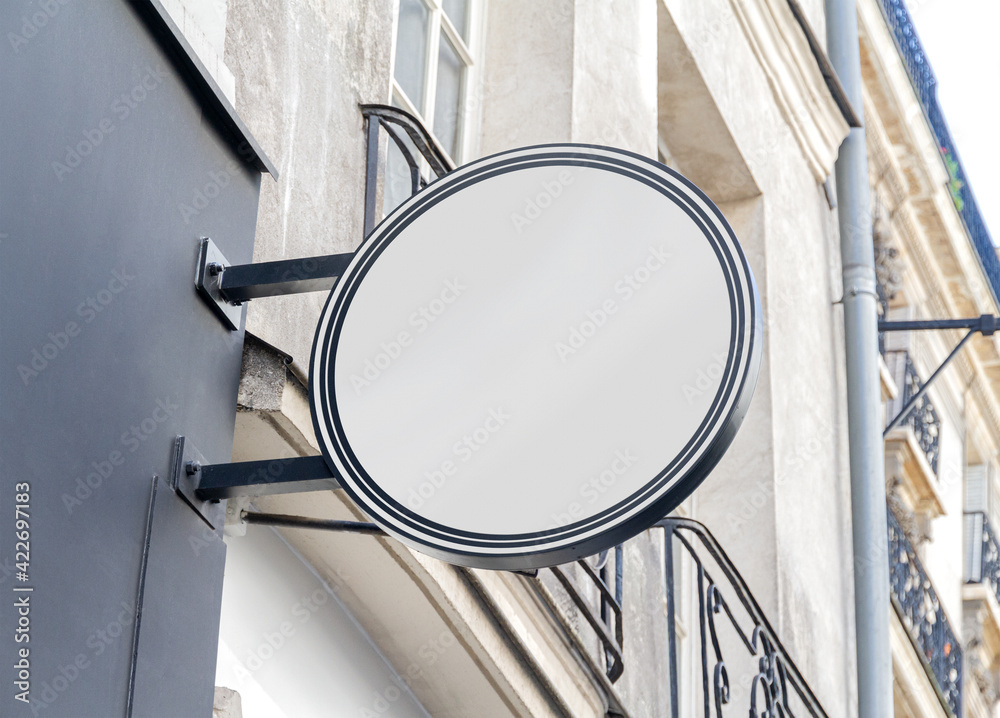 Circular store brand sign board mockup. Empty shop frontage in street ...