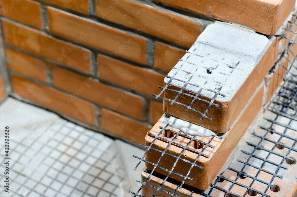 Modern layout of the construction of walls with brick masonry. External ...