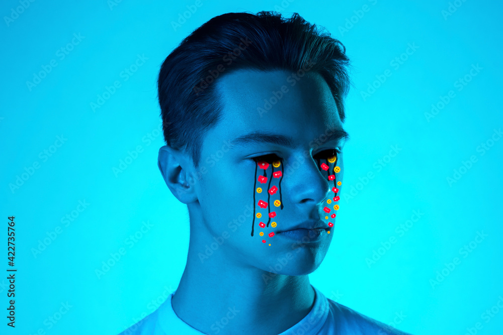 Tears illustrated of social media activity signs on male face in neon ...