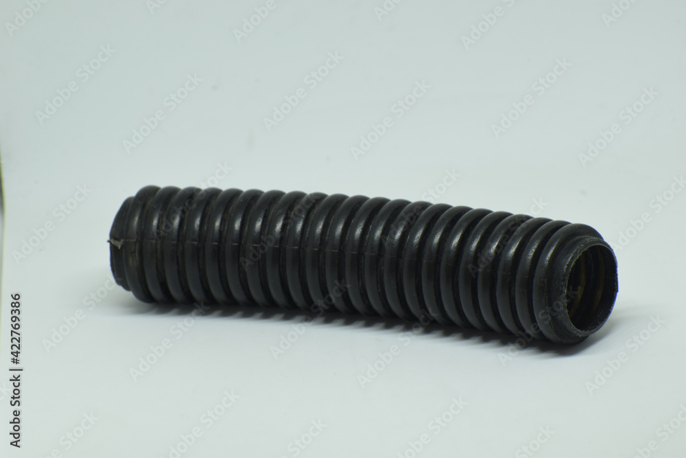 Piece of black corrugated tube on a white background Stock Photo ...