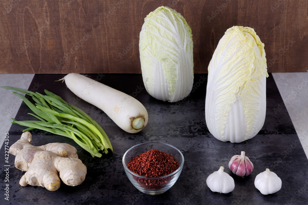 Various vegetable ingredients to make kimchi: napa cabbage, white ...