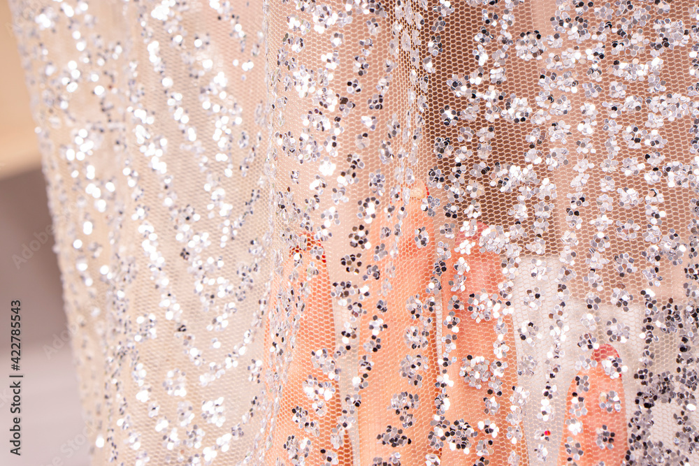 mesh fabric texture with sequins Texture cloth mesh. Female hand shows ...