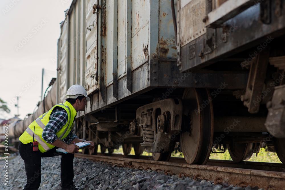 person with a train. Worker work and check break system of train ...