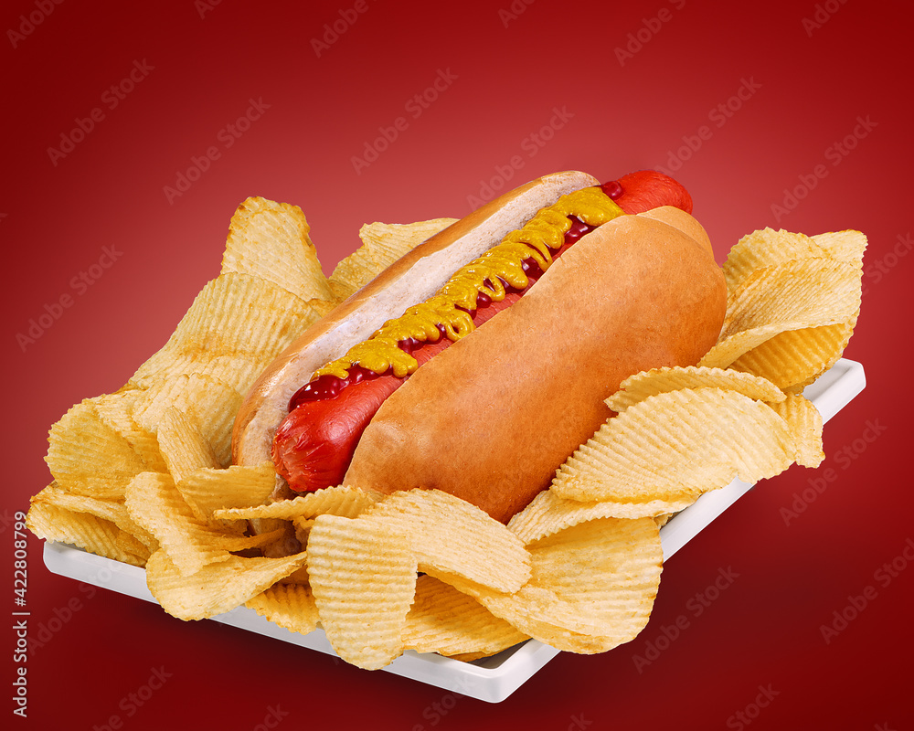 juicy hot dog with katchup and mustard over potato chips cradle Stock ...