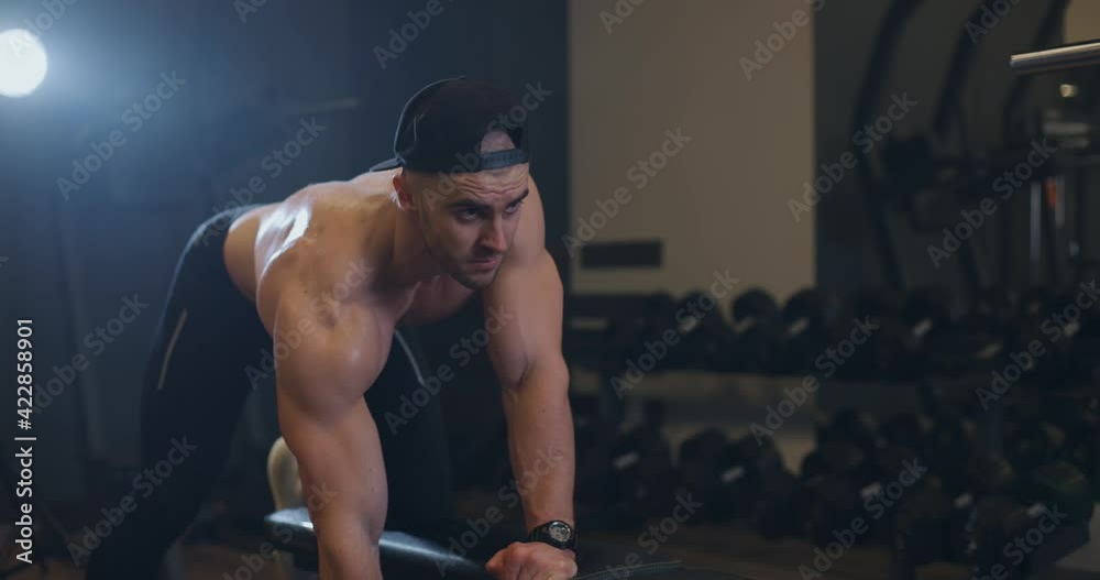 Handsome shirtless sporty muscular bodybuilder man excercise with ...