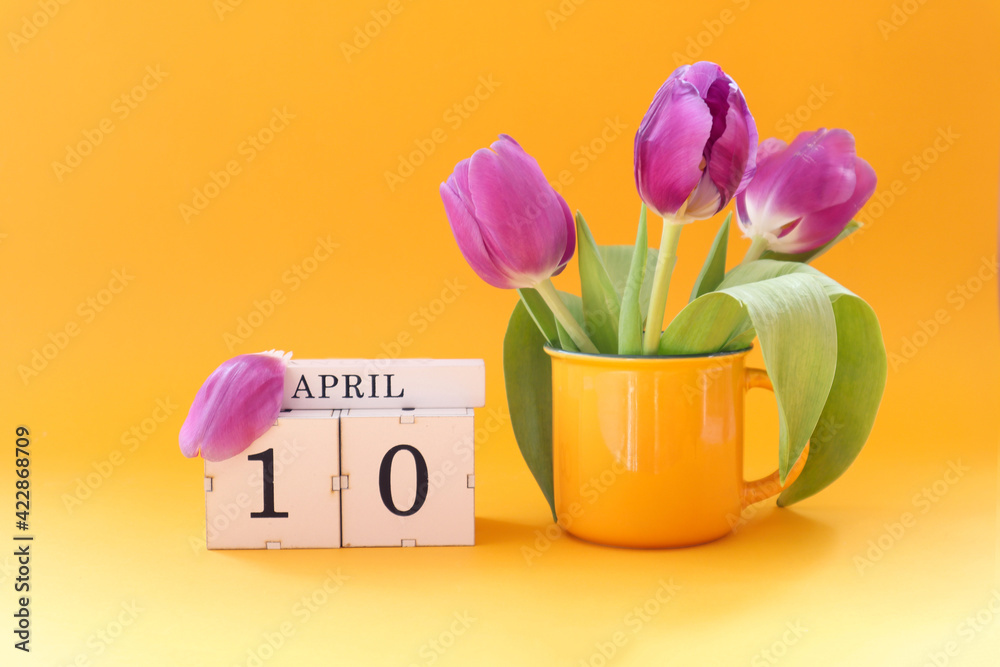 Calendar for April 10: cubes with the number 10, the name of the month ...