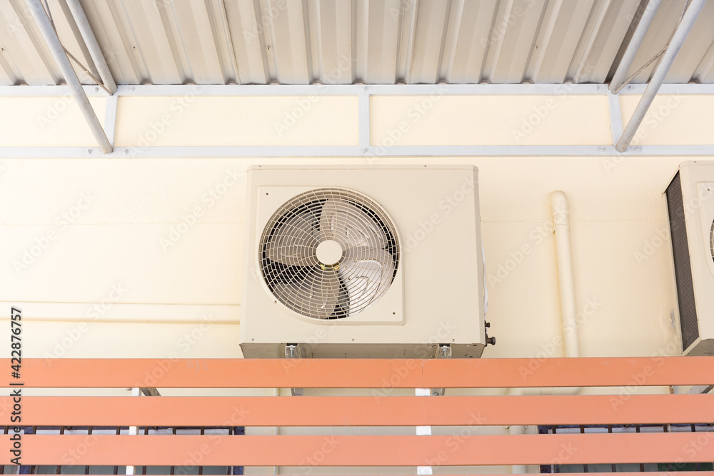 Condenser unit or compressor outside home or residential building. Unit ...