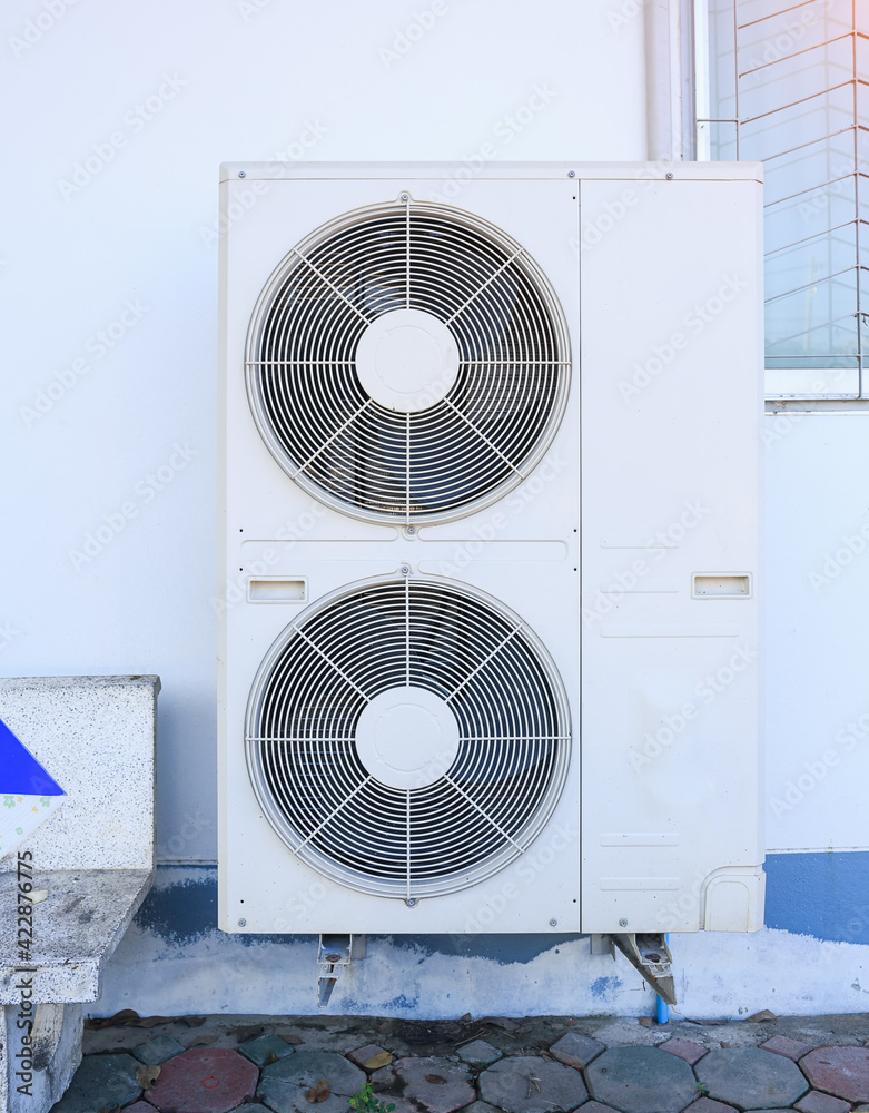 Condenser unit or compressor outside home or residential building. Unit ...