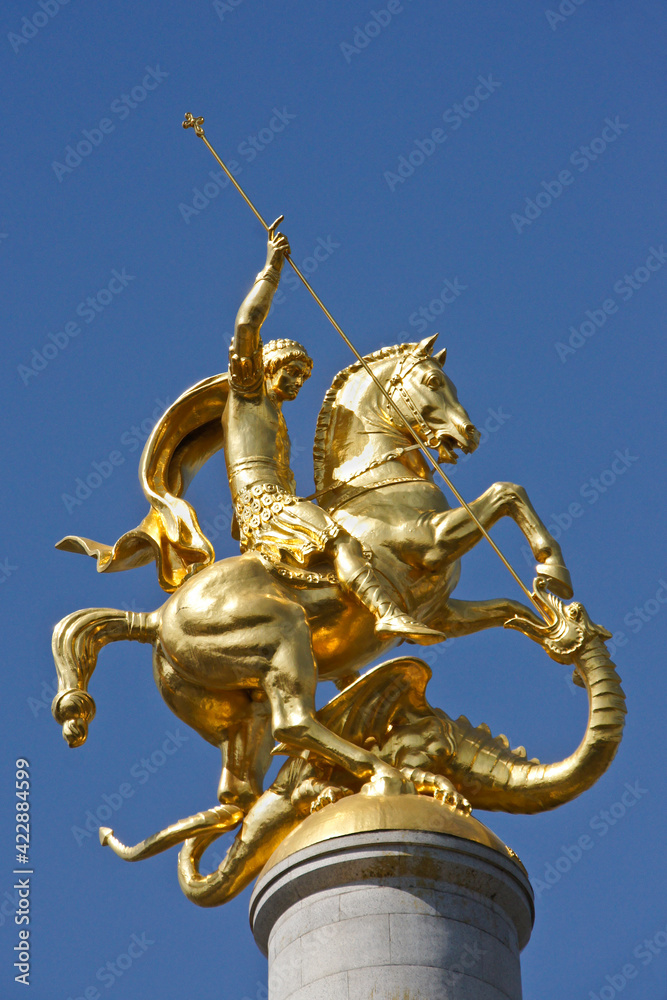 Gold sculpture of St. George slaying a dragon atop a column in Freedom ...