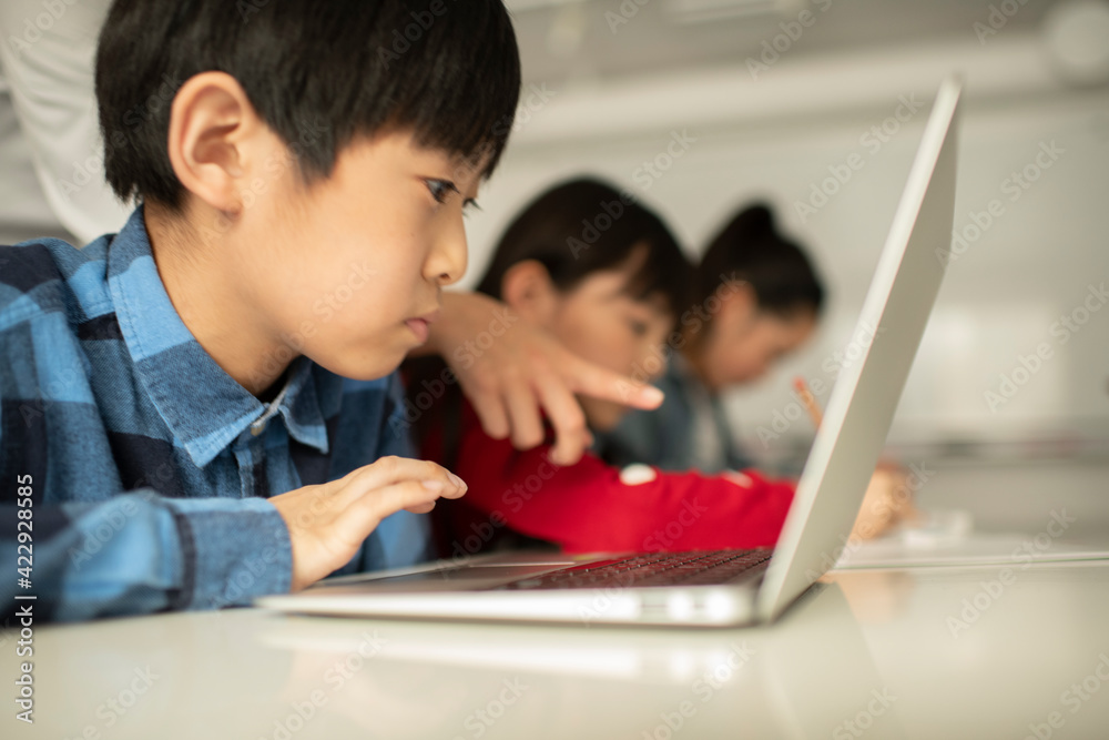 ICT in Education - Boy and Girl Looking at PC Stock Photo | Adobe Stock