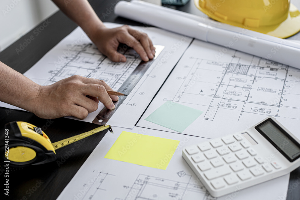 Home design architects are editing the drafts of the house plans, a ...