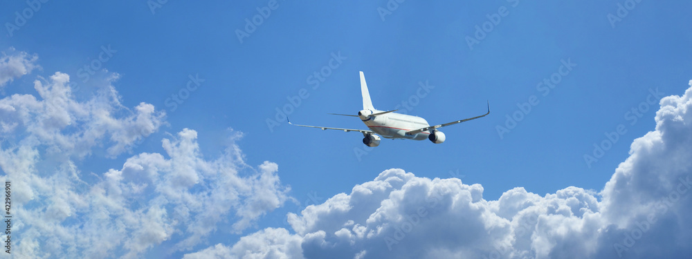 Ultra wide zoom photo of passenger airplane taking off in deep blue sky ...
