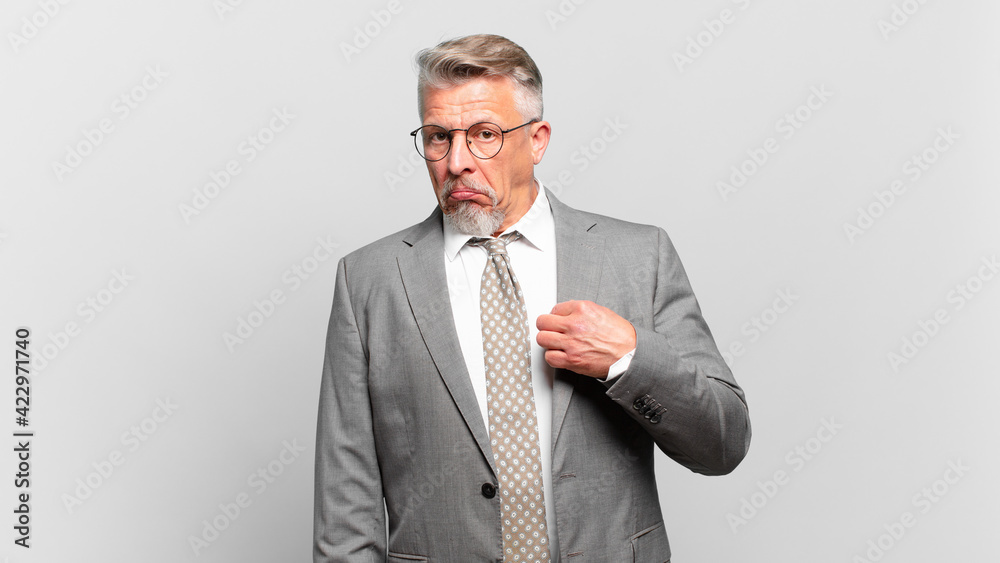 senior businessman looking arrogant, successful, positive and proud ...