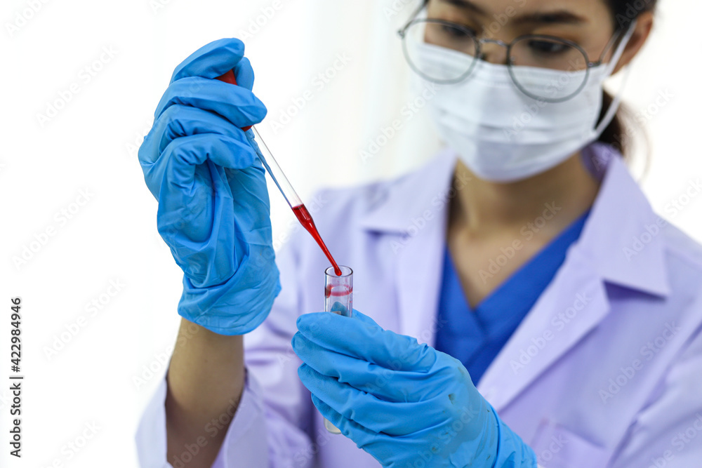 Scientist holding Coronavirus covid-19 infected blood sample tube DNA ...