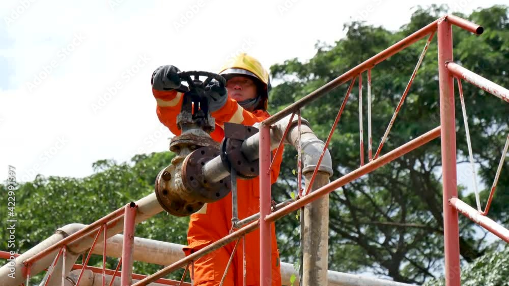 Firefighter fighting with flame using fire hose chemical water foam ...