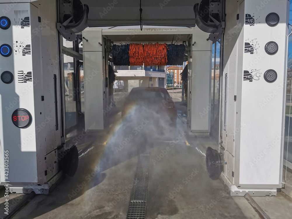 Car between water vapor in Automatic Car Wash Tunnel Stock Photo ...