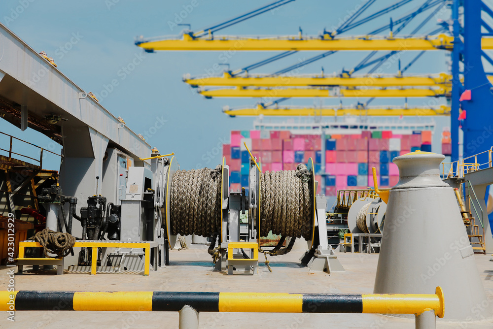 Mooring winch of large ship with winch rope in drum on main deck ship ...