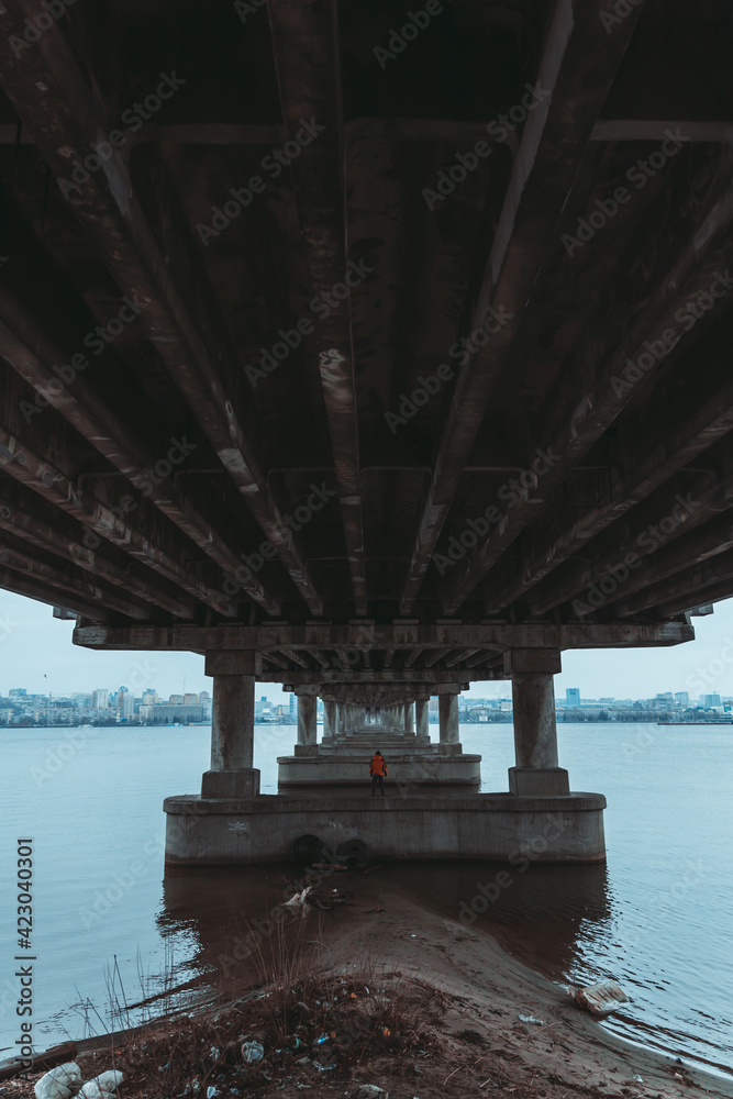 guy rufer climbed under the bridge with water. a man is photographed ...