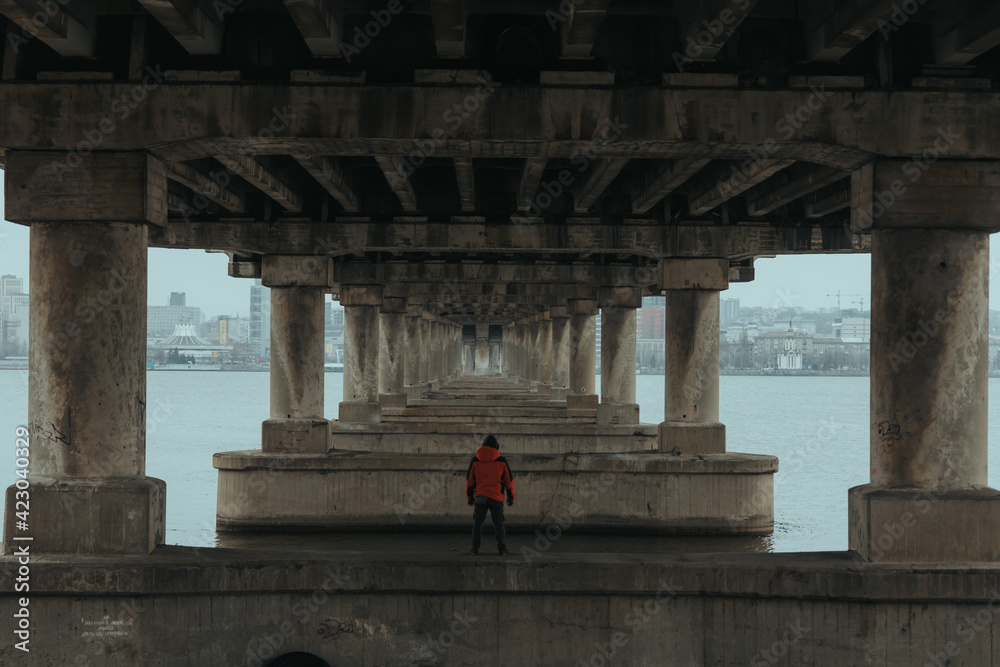 guy rufer climbed under the bridge with water. a man is photographed ...