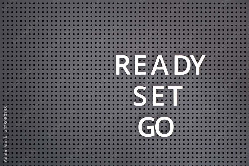 Words Ready, Set, Go spelled out with white letters on pegboard Stock ...