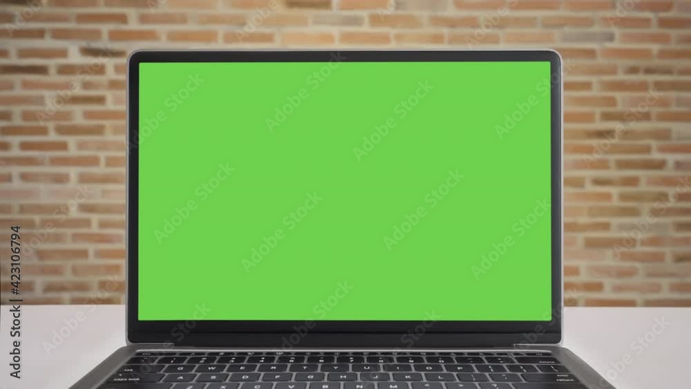 Close up display computer desktop with mock-up green screen on white ...