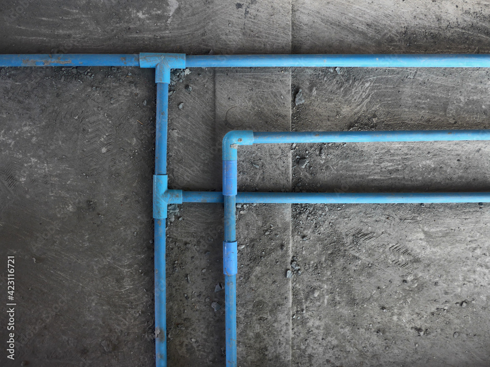 Blue PVC Piping System of Water on the concrete floor in construction ...