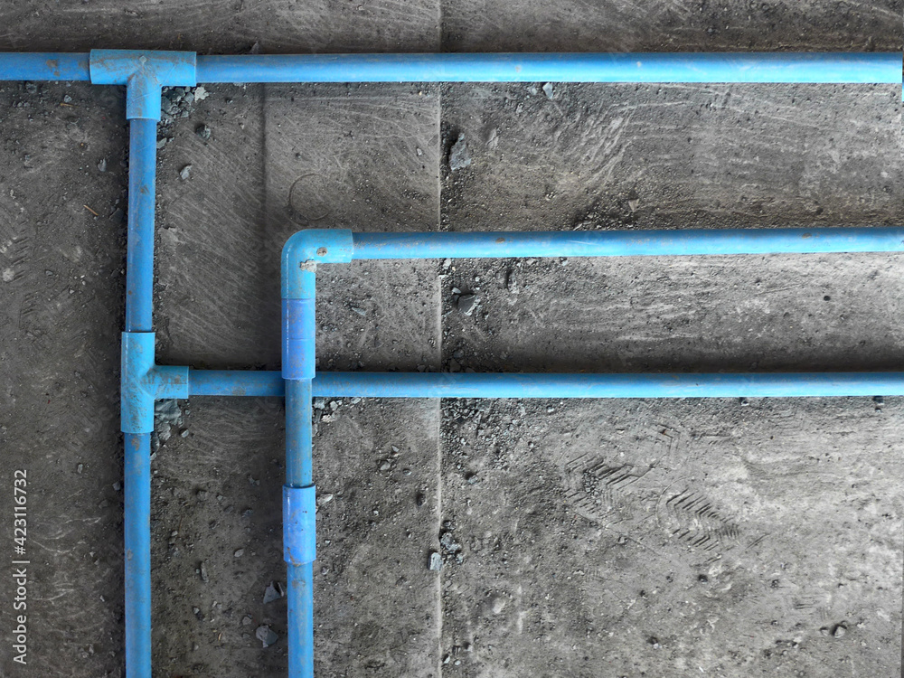 Blue PVC Piping System of Water on the concrete floor in construction ...
