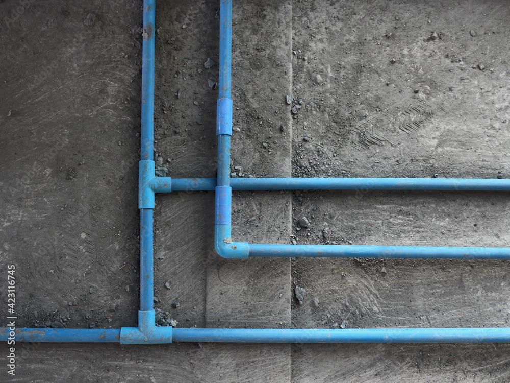 Blue PVC Piping System of Water on the concrete floor in construction ...