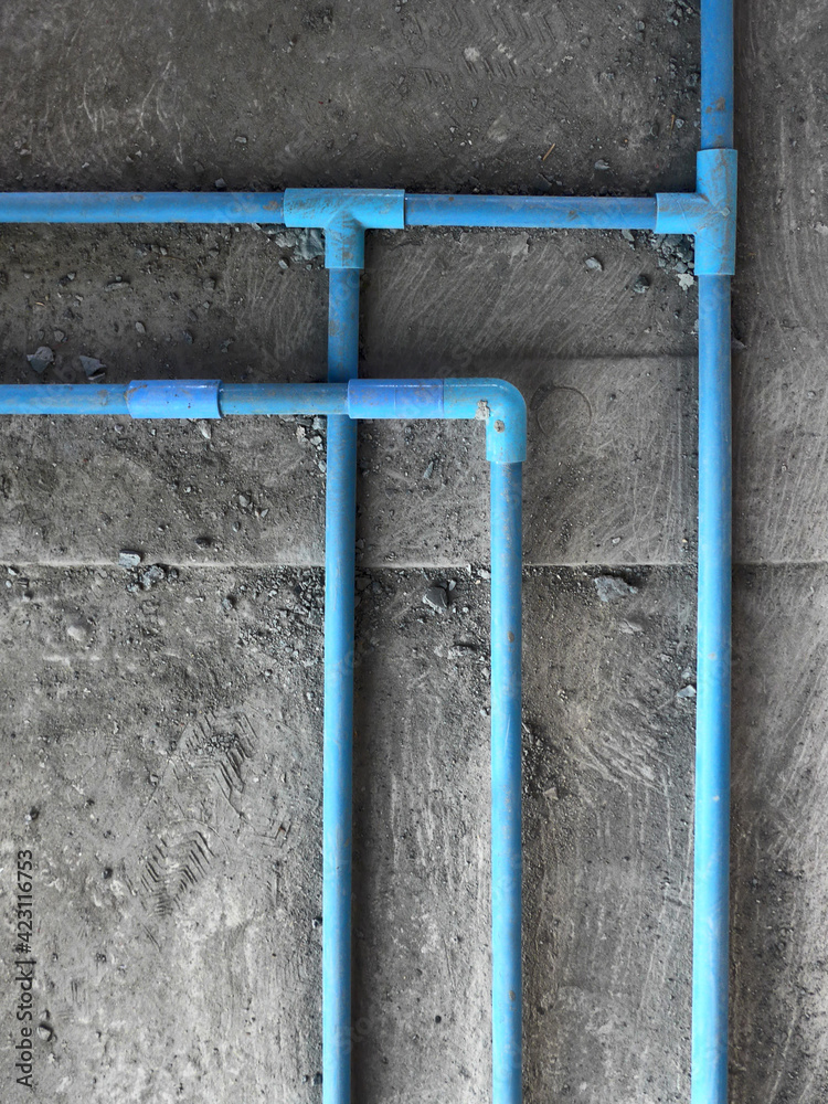 Blue PVC Piping System of Water on the concrete floor in construction ...