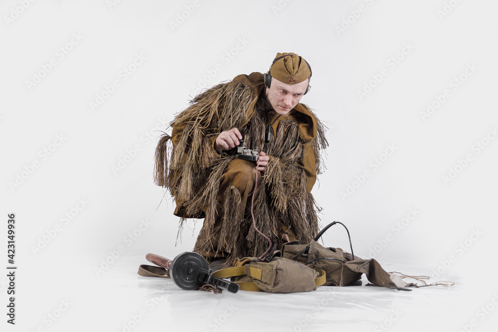 Man soldier radio operator of the Soviet army in old military uniform ...
