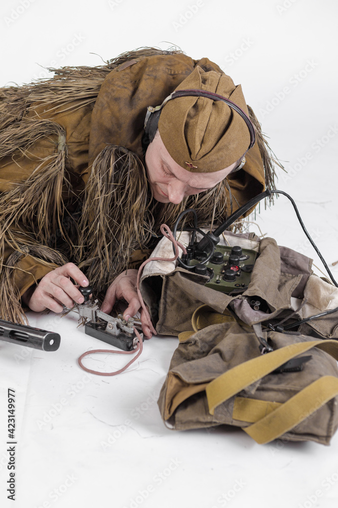 Man soldier radio operator of the Soviet army in old military uniform ...