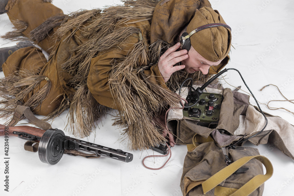 Man soldier radio operator of the Soviet army in old military uniform ...