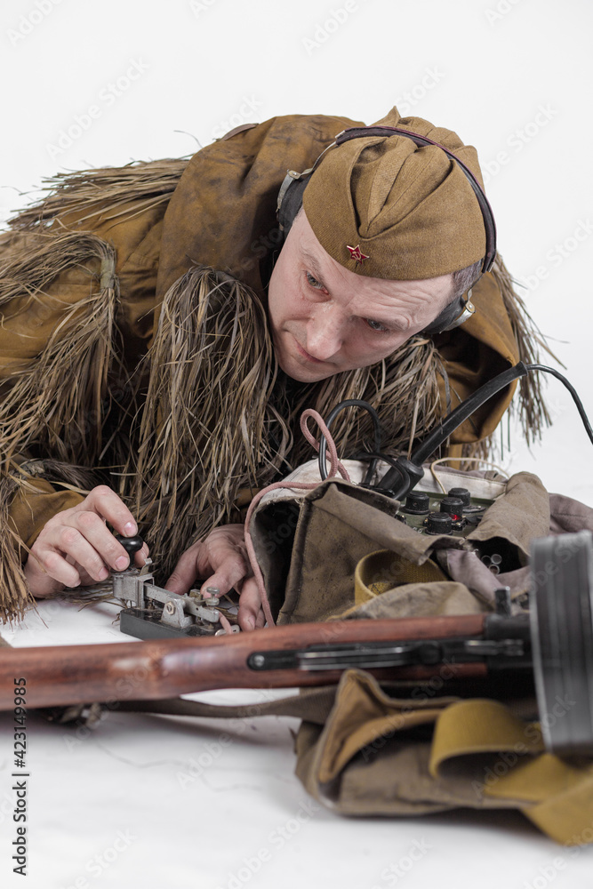 Man soldier radio operator of the Soviet army in old military uniform ...