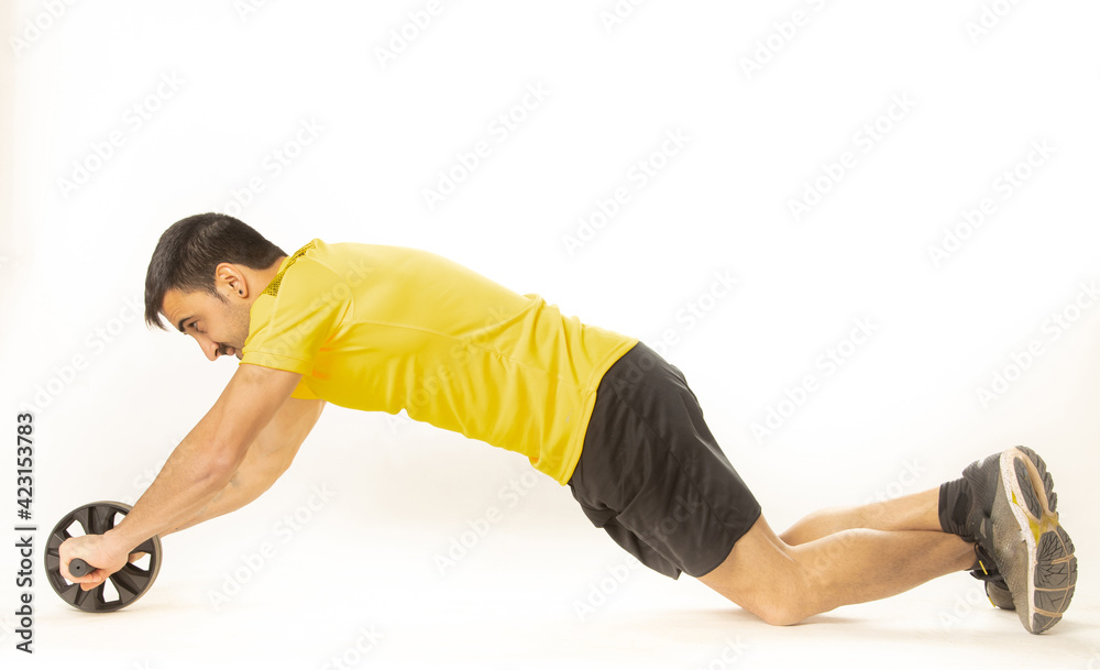 man with Ab roll Bodytone for abdominal strengthening. Small wheel that ...