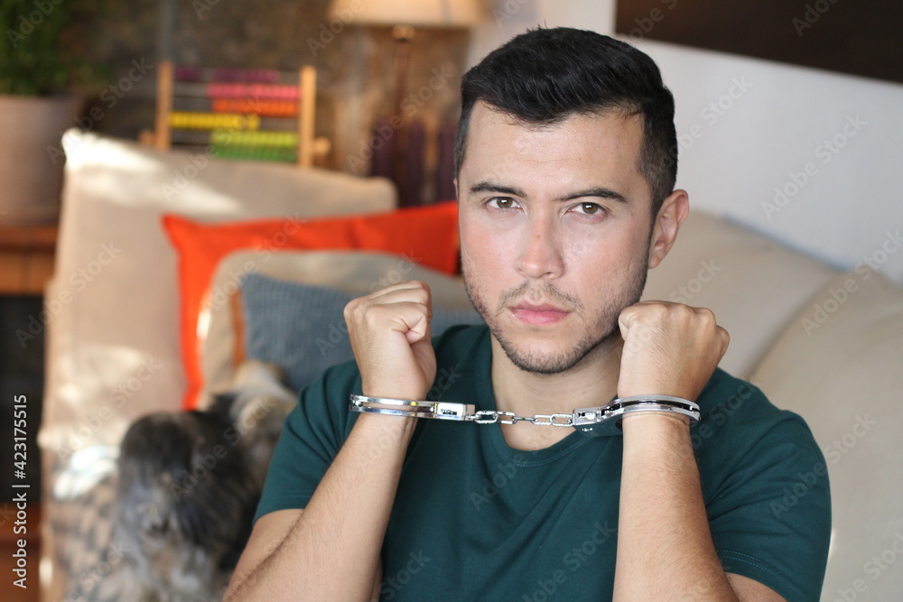 Young hug wearing handcuffs at home Stock Photo | Adobe Stock