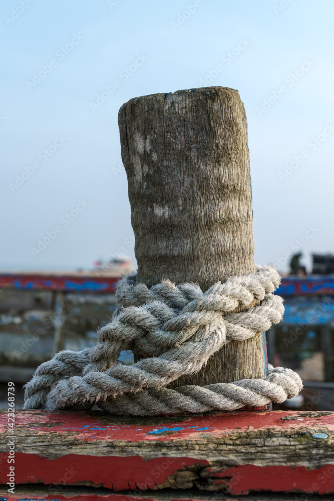 Rope coiled around a wooden post on a boat at Dungeness Stock Photo ...