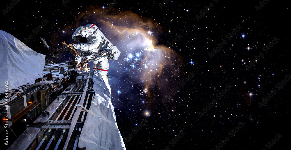 Astronaut spaceman do spacewalk while working for space station in ...