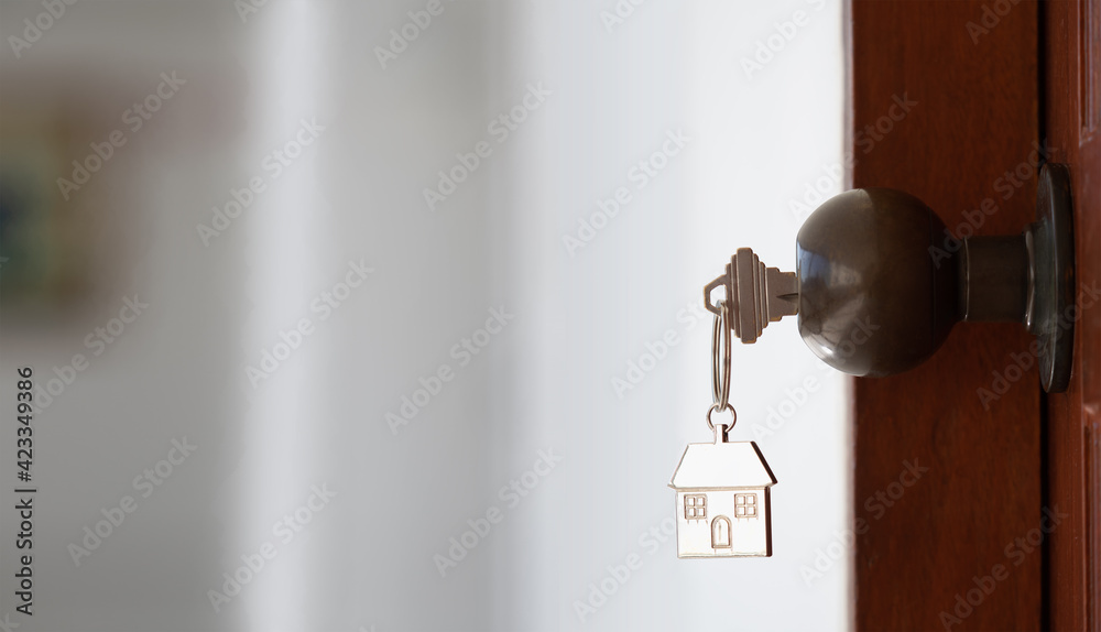 key with metal house symbol to open the door Stock Photo | Adobe Stock