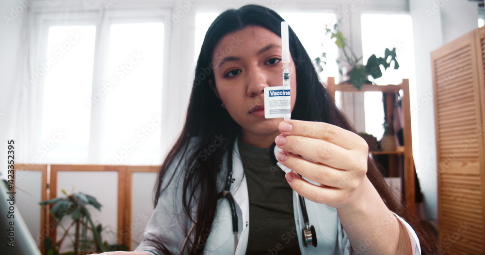 Vaccine trial inspection. Zoom in on professional multiethnic ...