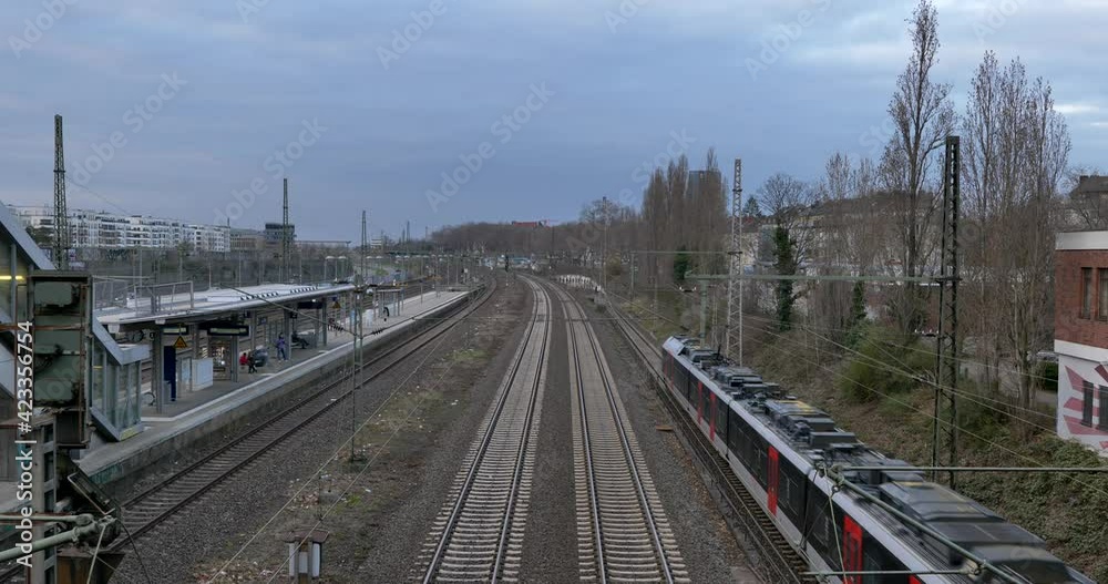 Night cloudy outdoor scenery and top view over platform railway station ...