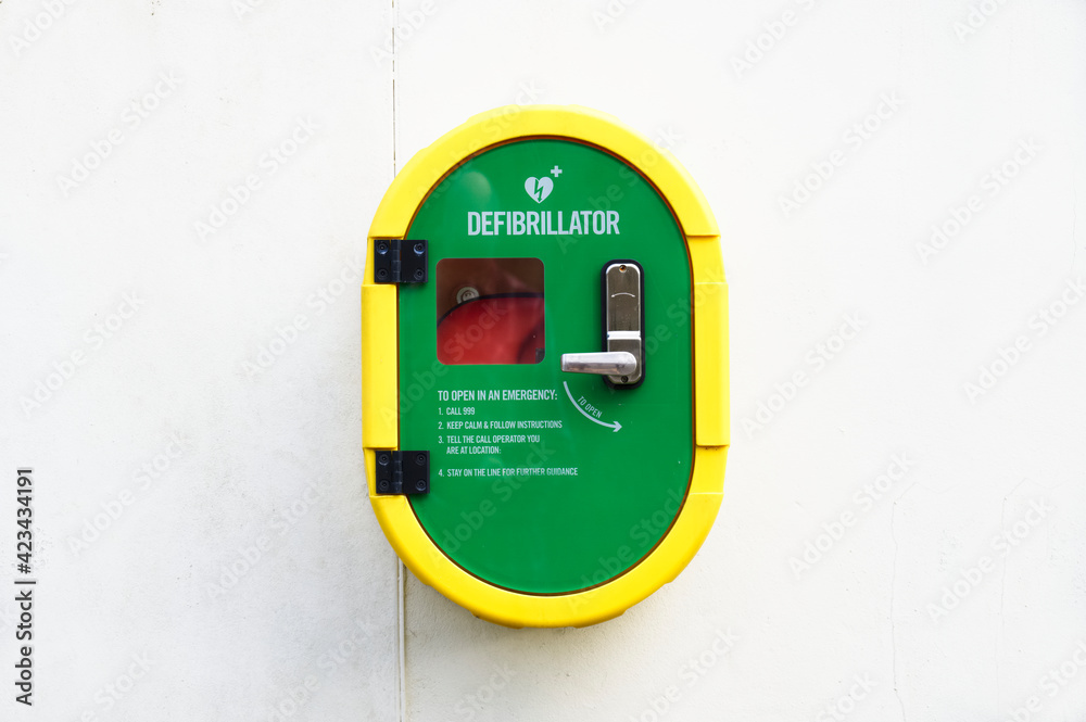 Poster Defibrillator AED on wall in public space for emergency heart ...
