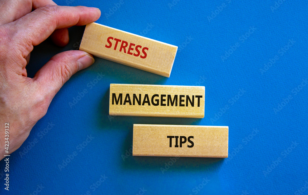 Stress management tips symbol. Wooden blocks with words 'Stress ...