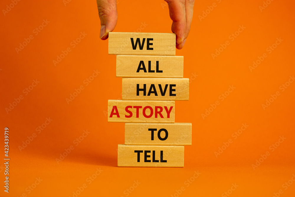 We all have a story to tell symbol. Wooden blocks with words 'We all ...