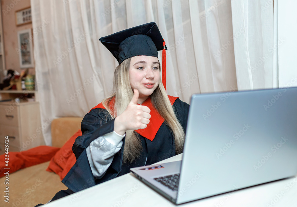Virtual graduation and convocation ceremony. Excited student wearing ...