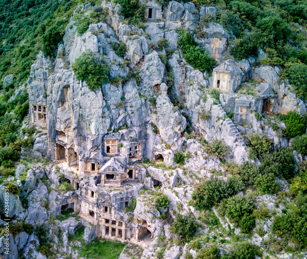High angle drone aerial view of ancient greek rock cut tombs carved ...