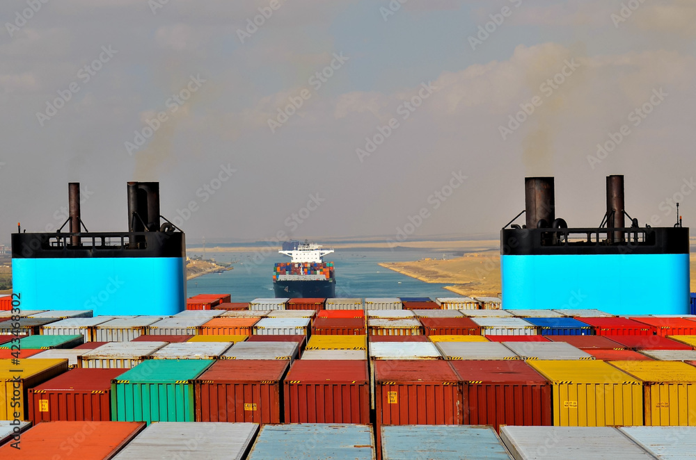 Container ship transiting through Suez Canal. View on the funnels ...