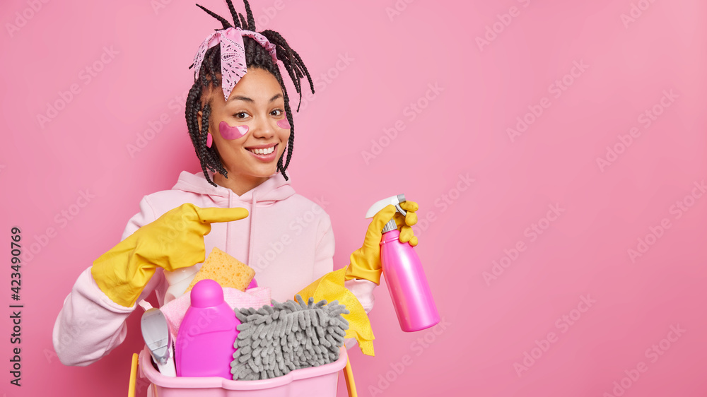 Ready for spring cleaning. Positive African American woman with ...