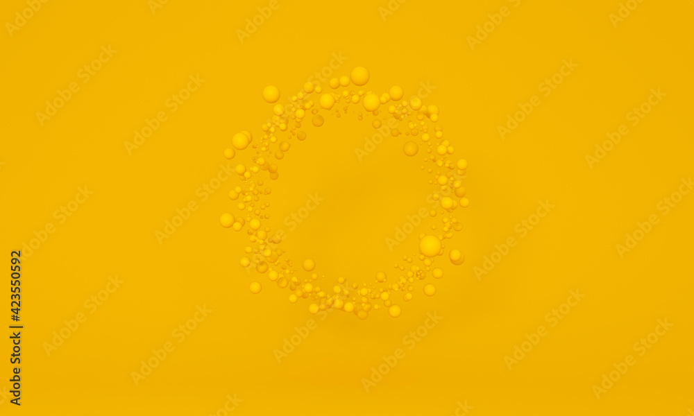 Yellow particles forming a circle floating on studio background ...