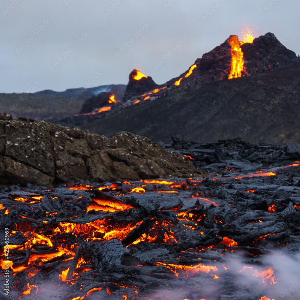 Lava flows from a small volcanic eruption in the Geldingardalur Valleys ...