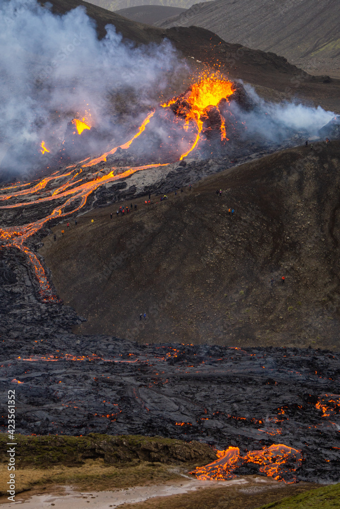 Lava flows from a small volcanic eruption in the Geldingardalur Valleys ...